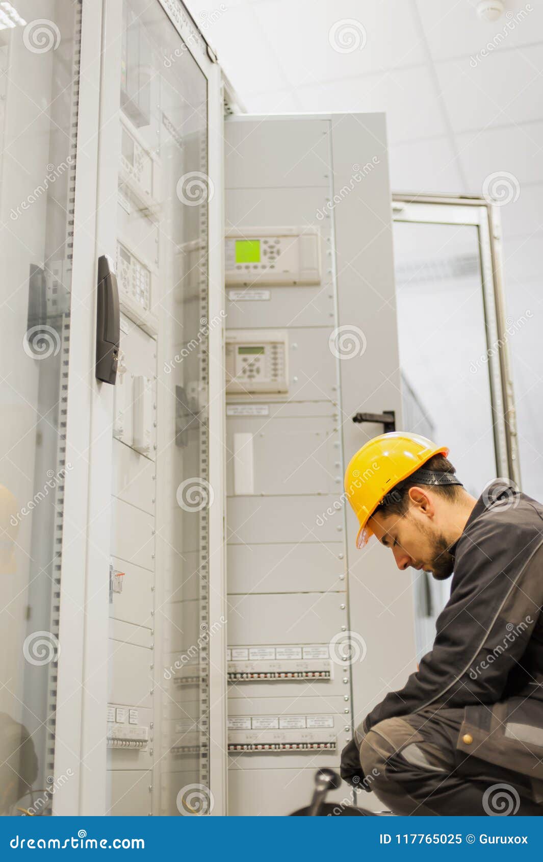 Maintenance Engineer Testing Voltage Switchgear and Bay Control Stock ...
