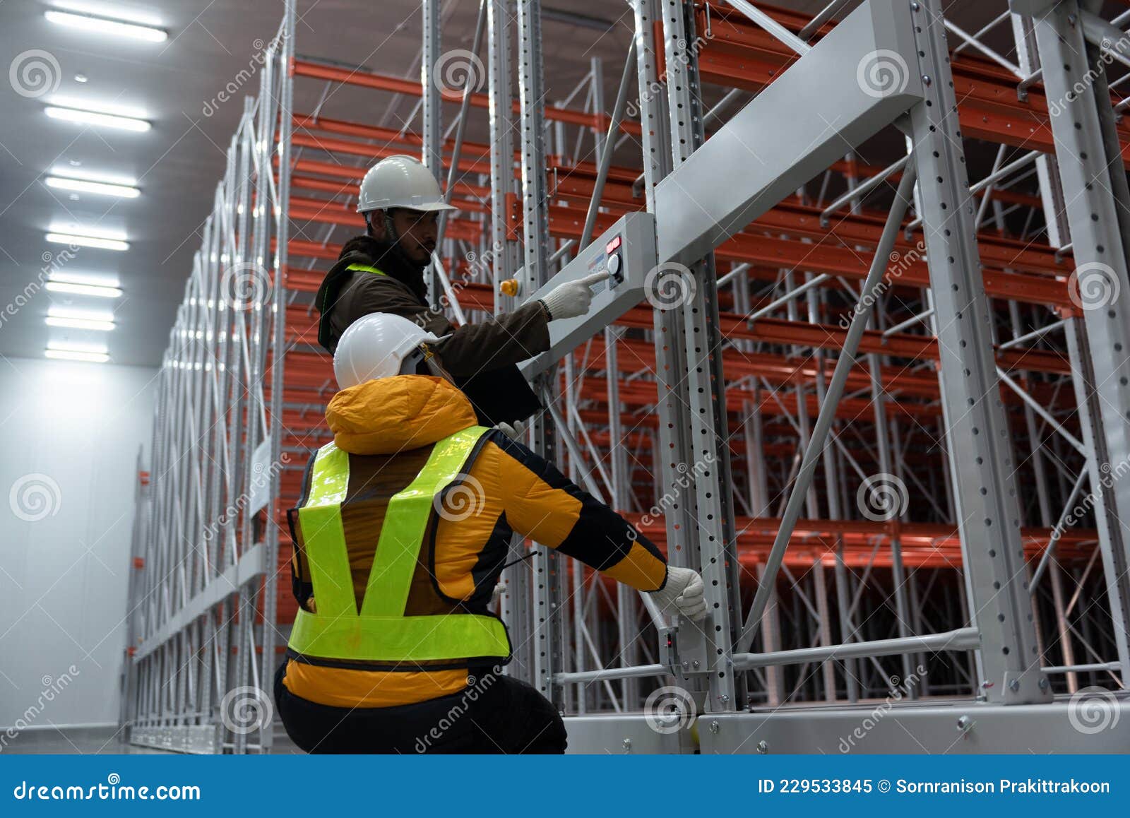 Maintenance Engineering Checking Moving Rack System in Warehouse ...