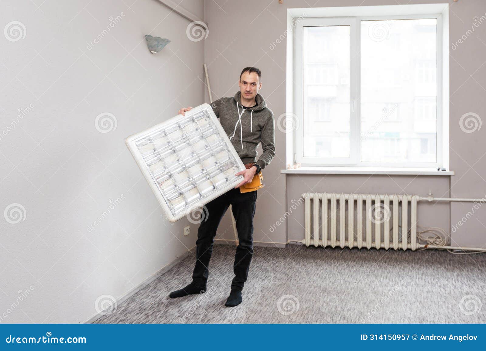 Maintenance Man Changing Light Bulbs in Office Stock Image - Image of ...