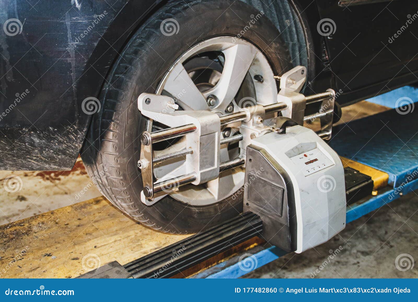 Car Wheel Fixed with Computerized Wheel Alignment Machine in a ...
