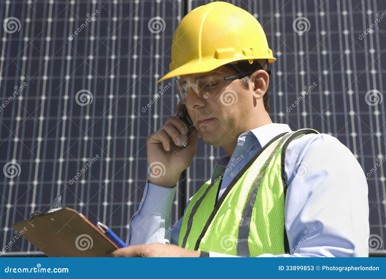 Maintenance Worker Using Cell Phone Near Solar Panels Stock Image ...