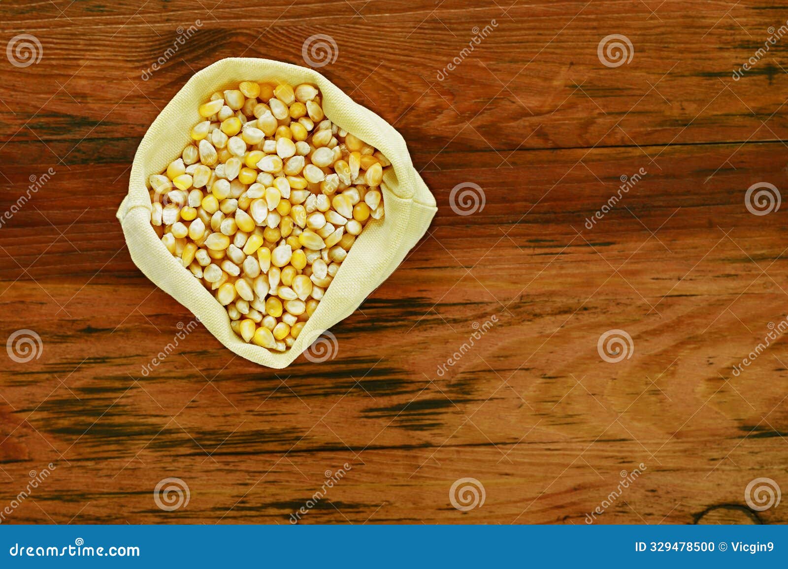 Maize grains in yellow bag stock photo. Image of eating - 329478500