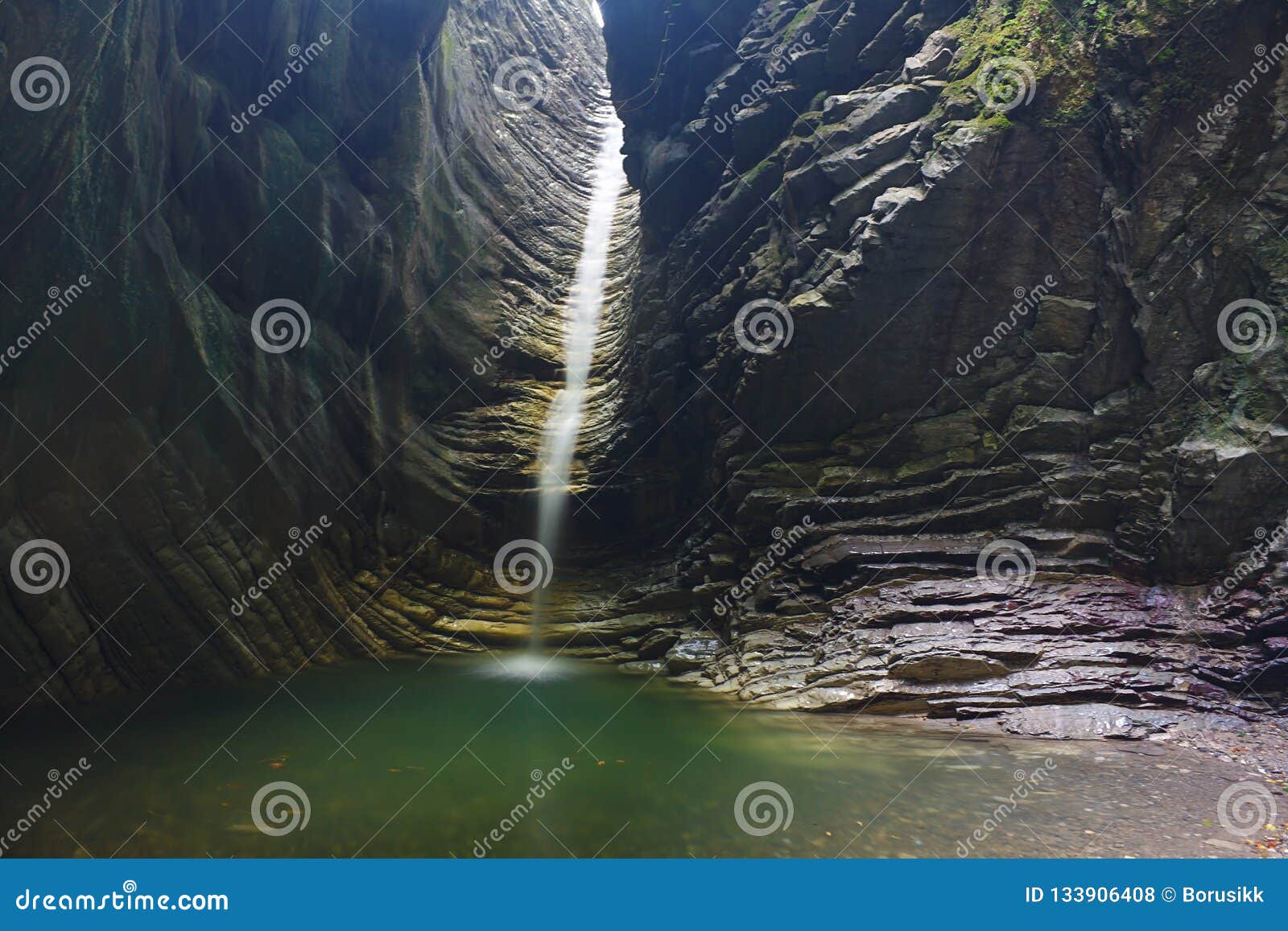 Majestic Cave with Flowing Beautiful Waterfall Stock Photo - Image of ...