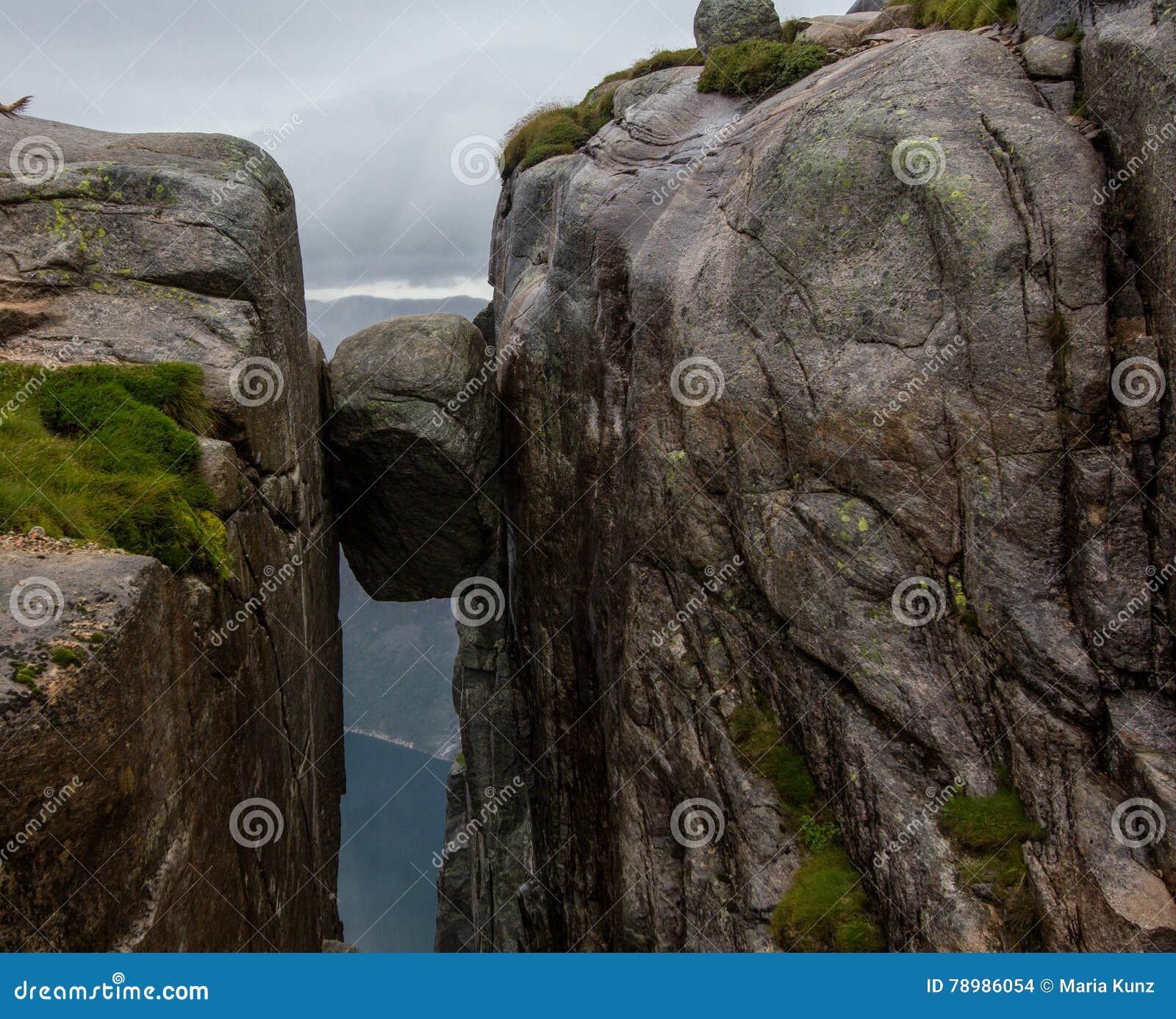 Hanging Stone Lies On Sloping Surface Of Mountain Above Precipice. A ...