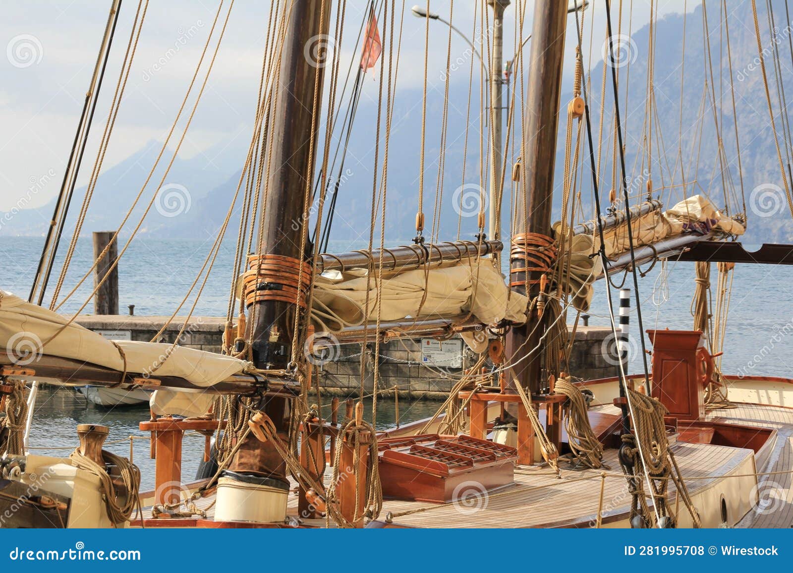 Majestic Tall Sailing Ship Departing from a Dock, with Ropes Billowing ...