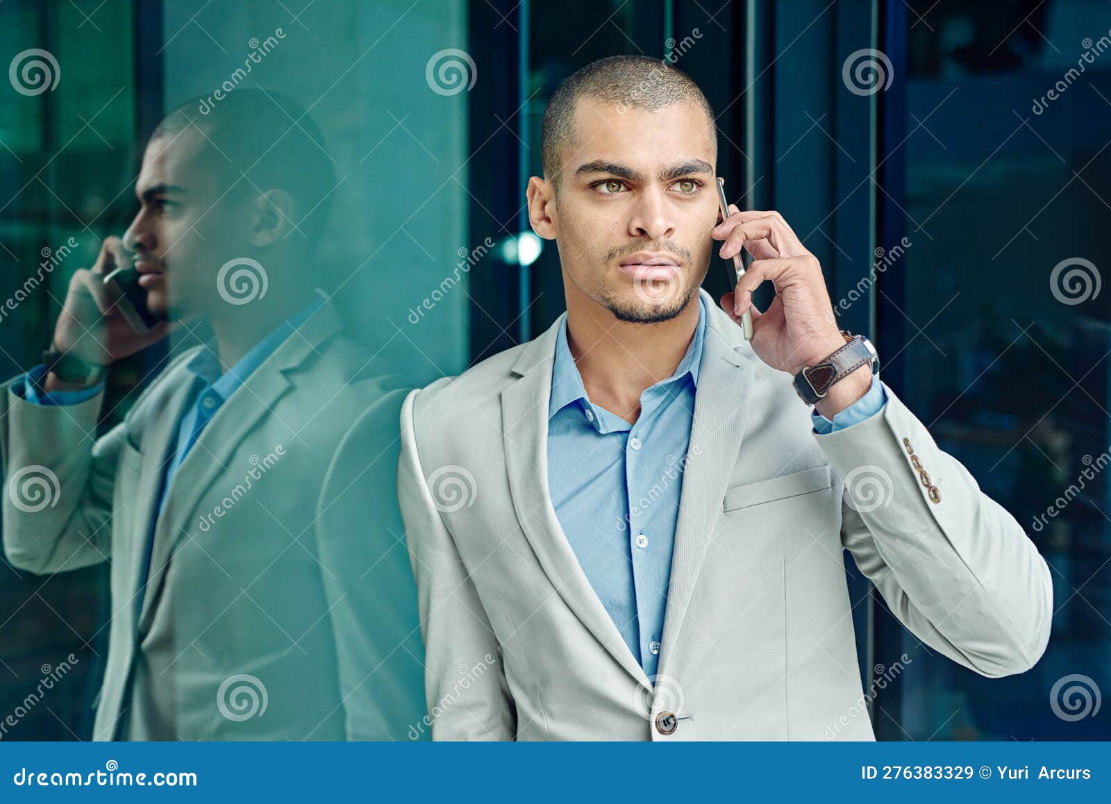 Make that Call and Make it Happen. a Young Businessman Using His Phone ...