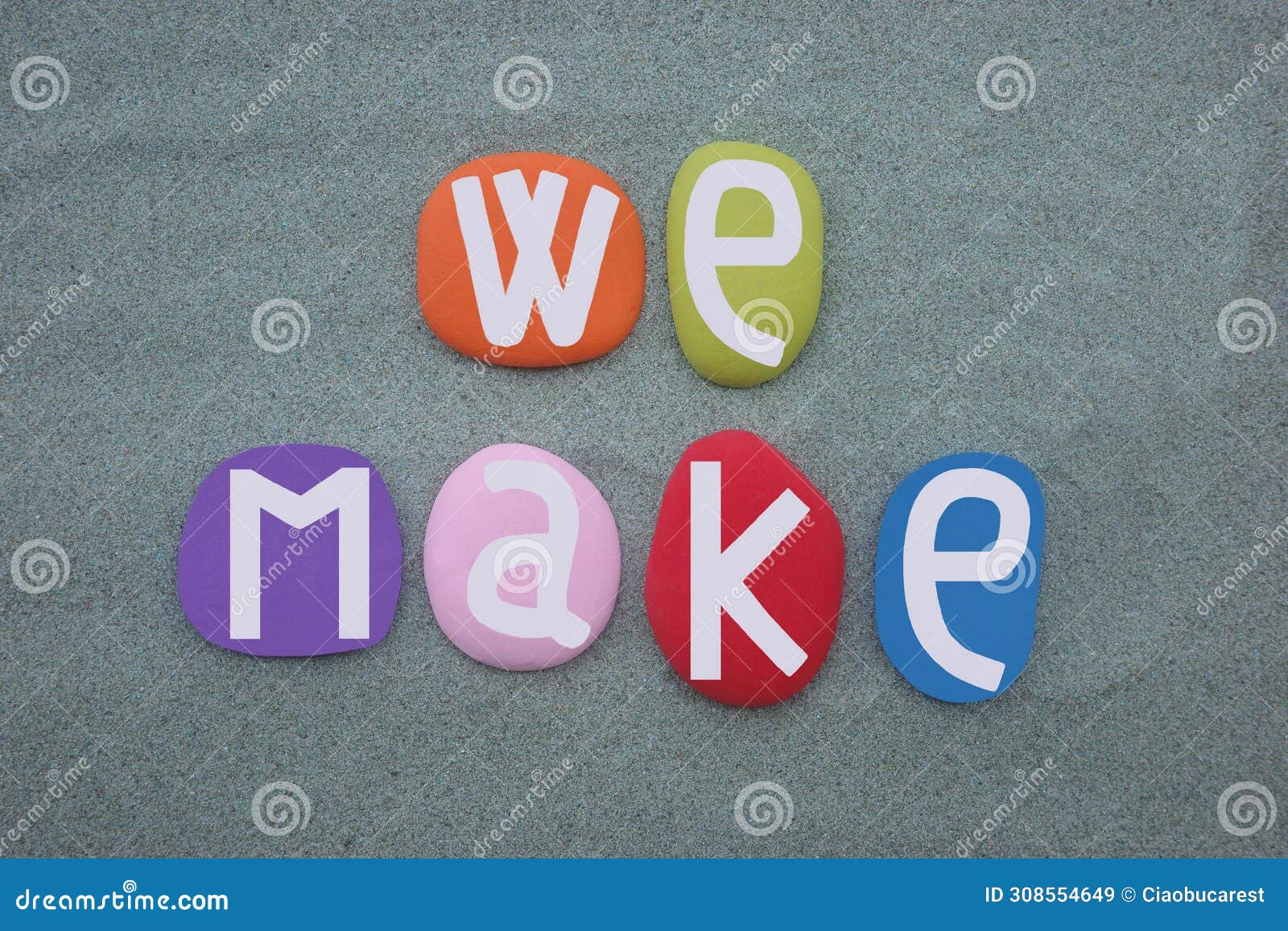 We Make, Creative Slogan Composed with Multi Colored Stone Letters Over ...