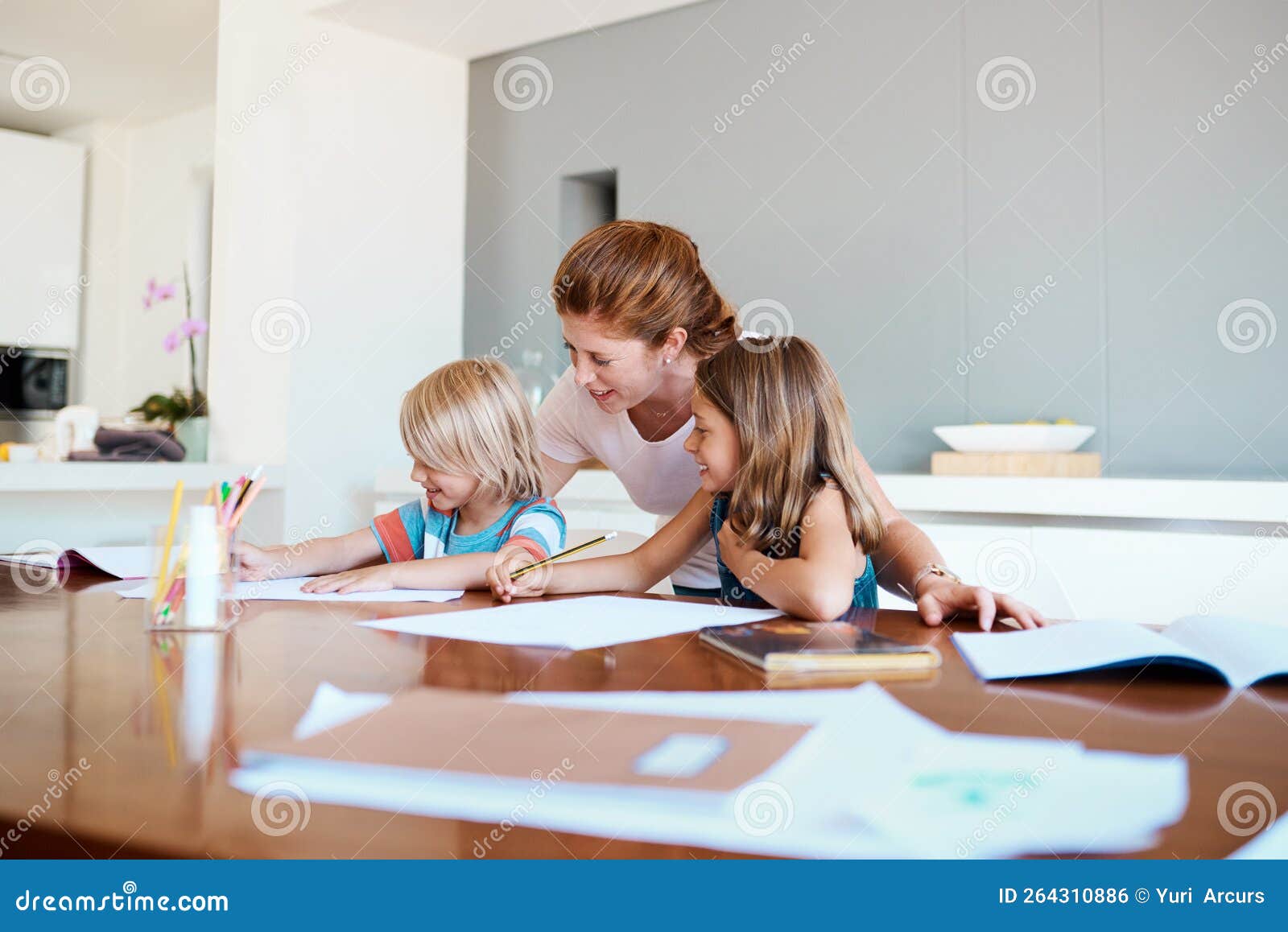 Make Doing Homework a Fun Activity in the House. a Young Mother Helping ...