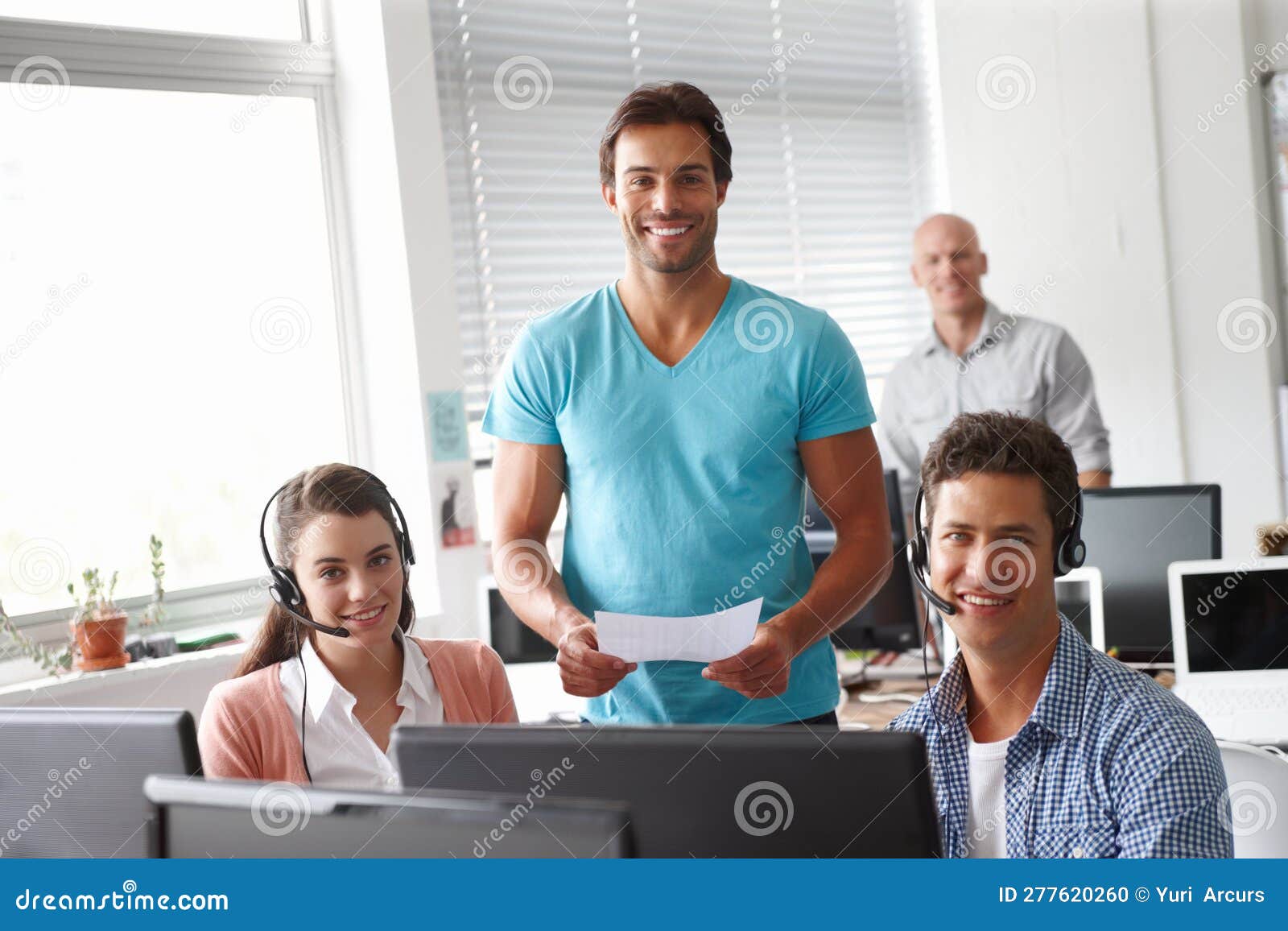 They Make a Dynamic Team. Profile of a Handsome Supervisor Standing ...