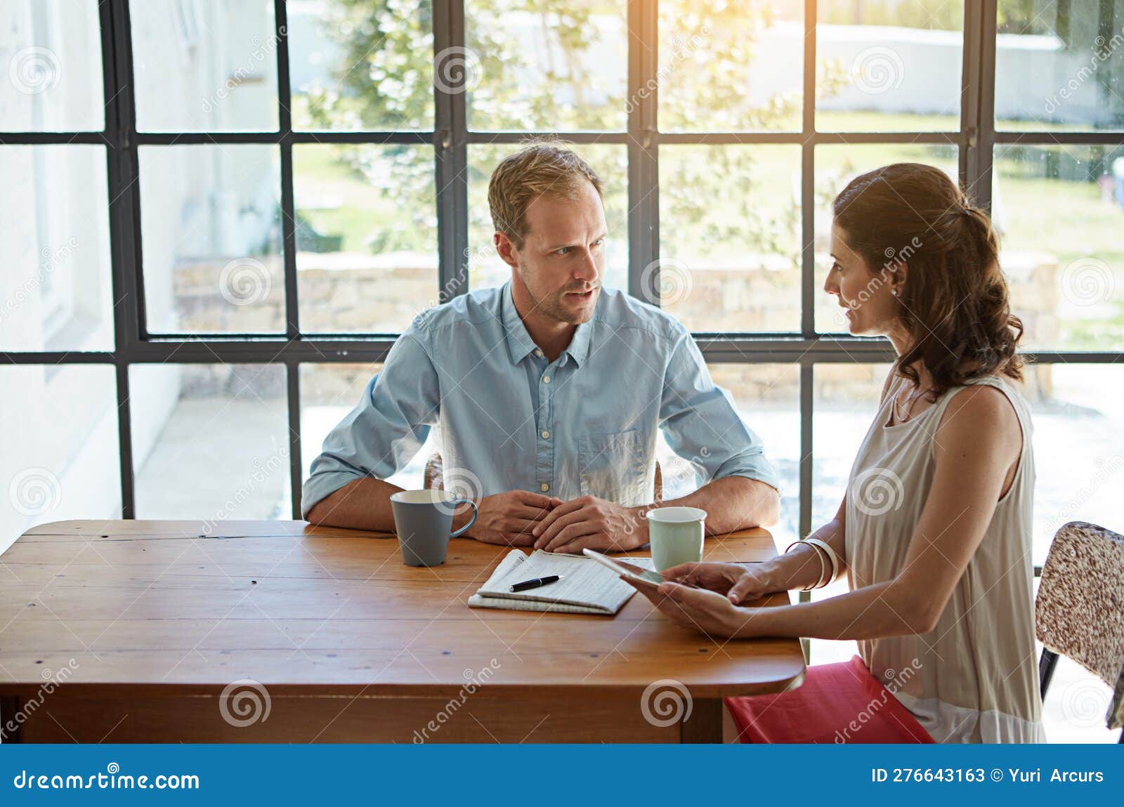 They Make Every Decision Together. a Married Couple Using Their Tablet ...