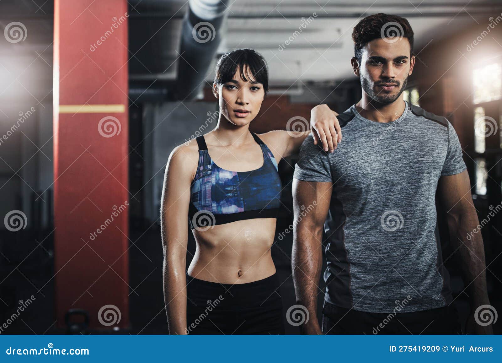 We Make Exercise a Priority. Portrait of Two Young People at the Gym ...