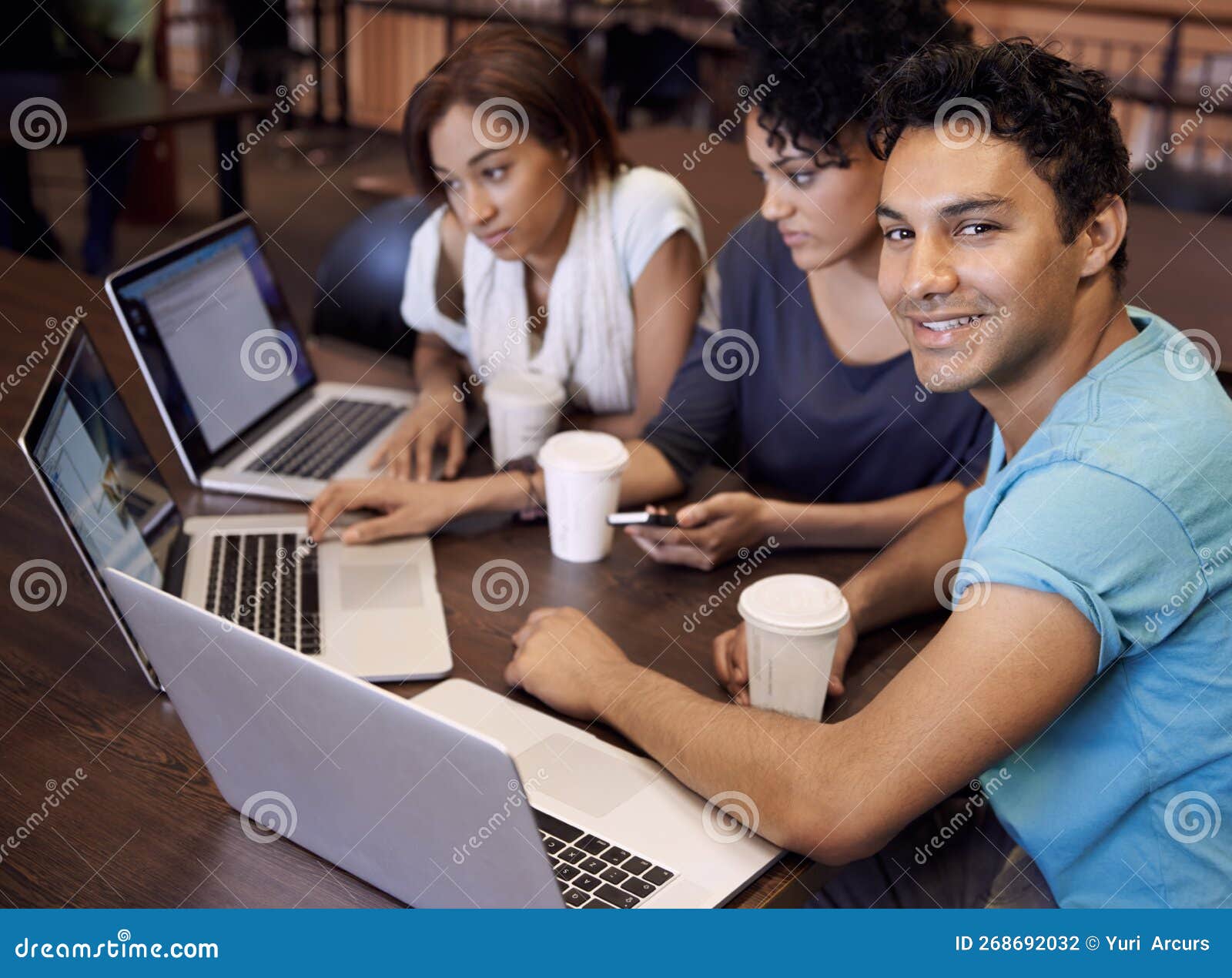 We Make Studying Look Easy. a Group of Students Using a Laptop To ...