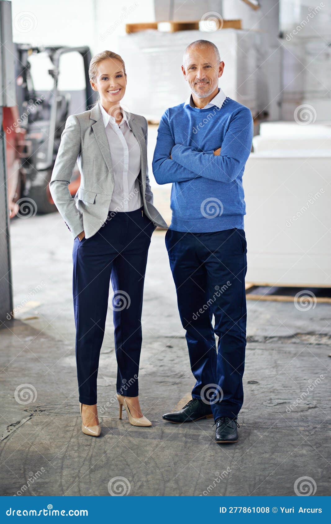 We Make Success Happen. Two Managers on the Factory Floor Looking ...
