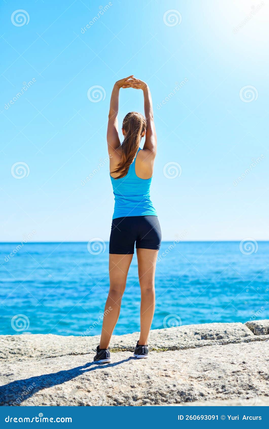 Make Sure Stretching is Part of Your Workout. a Young Woman Stretching ...