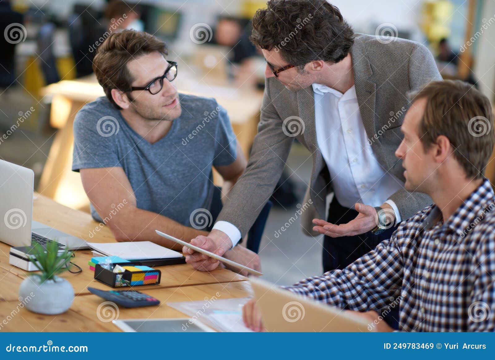 We Make Technology Work for Us. Shot of Business Colleagues Discussing ...