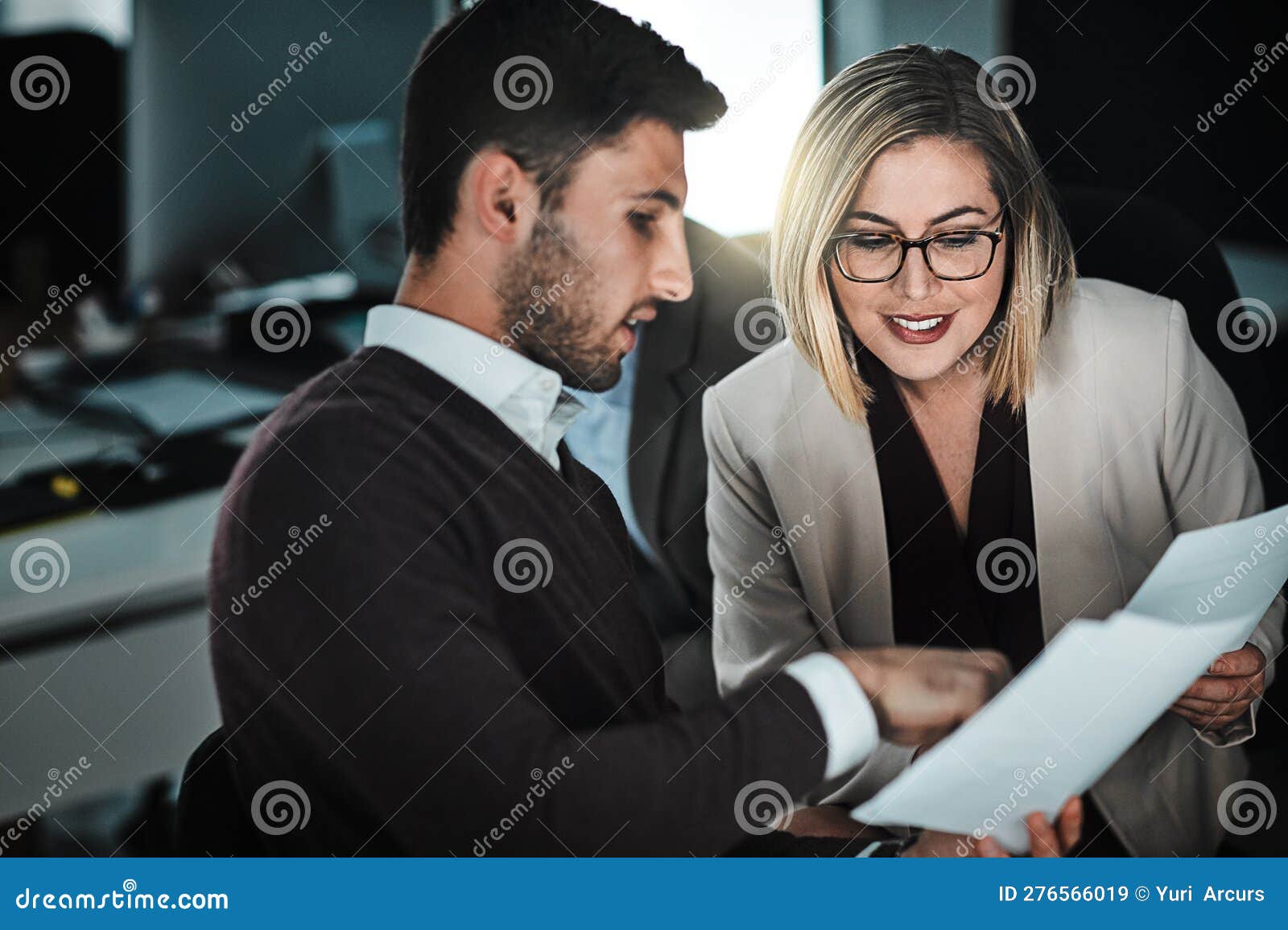 We Make Things Happen. Two Businesspeople Discussing Paperwork. Stock ...