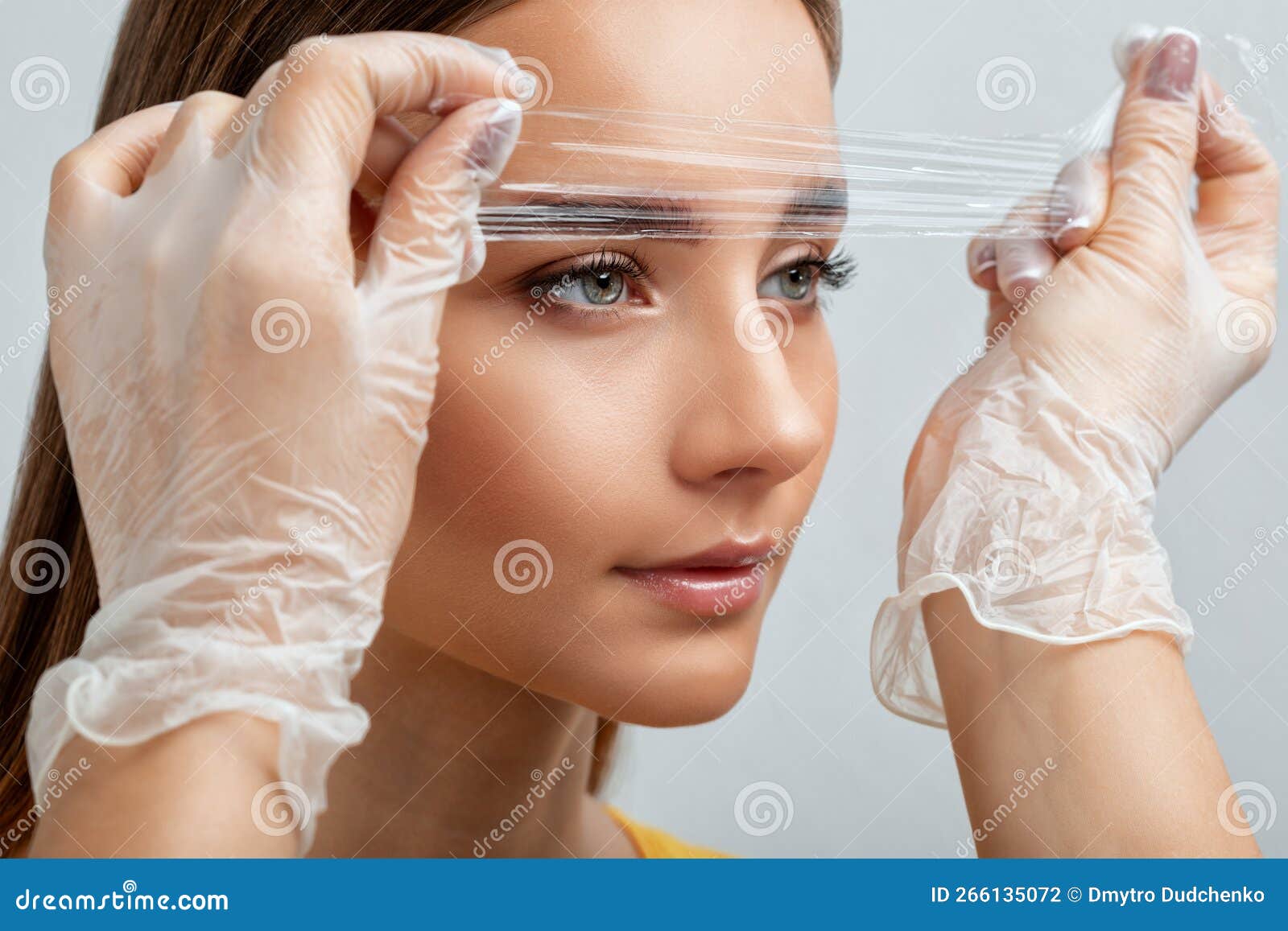 The Make-up Artist Does Long-lasting Styling of the Eyebrows of the ...