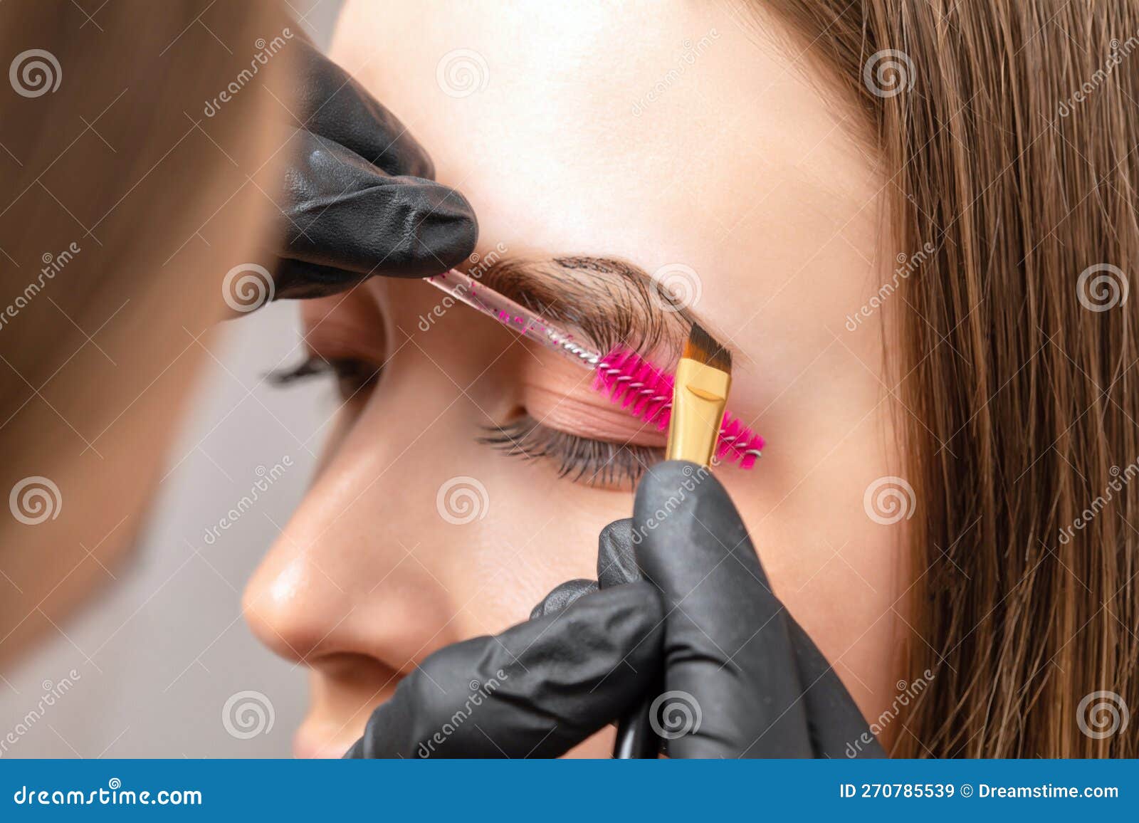 The Make-up Artist Does Long-lasting Styling of the Eyebrows of the ...