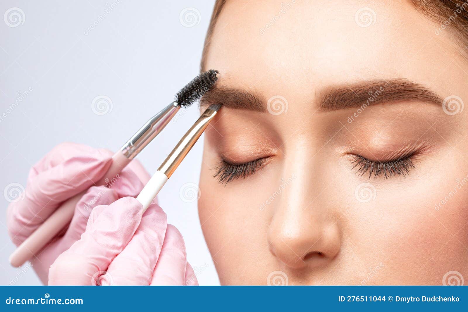 The Make-up Artist Does Long-lasting Styling of the Eyebrows of the ...