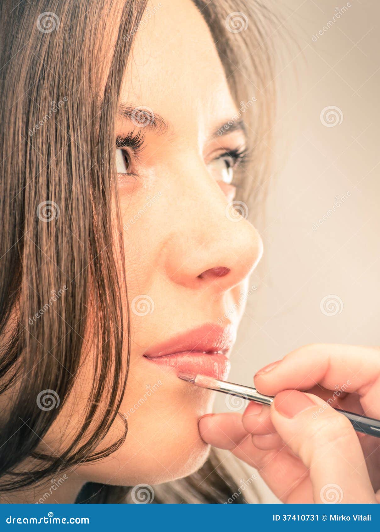 Make-up Artist Refining Lips of a Beautiful Young Model Stock Image ...
