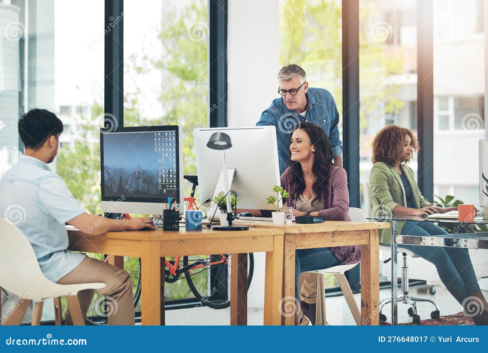 He Makes it Look so Easy. Group of Creative Colleagues Working on a ...