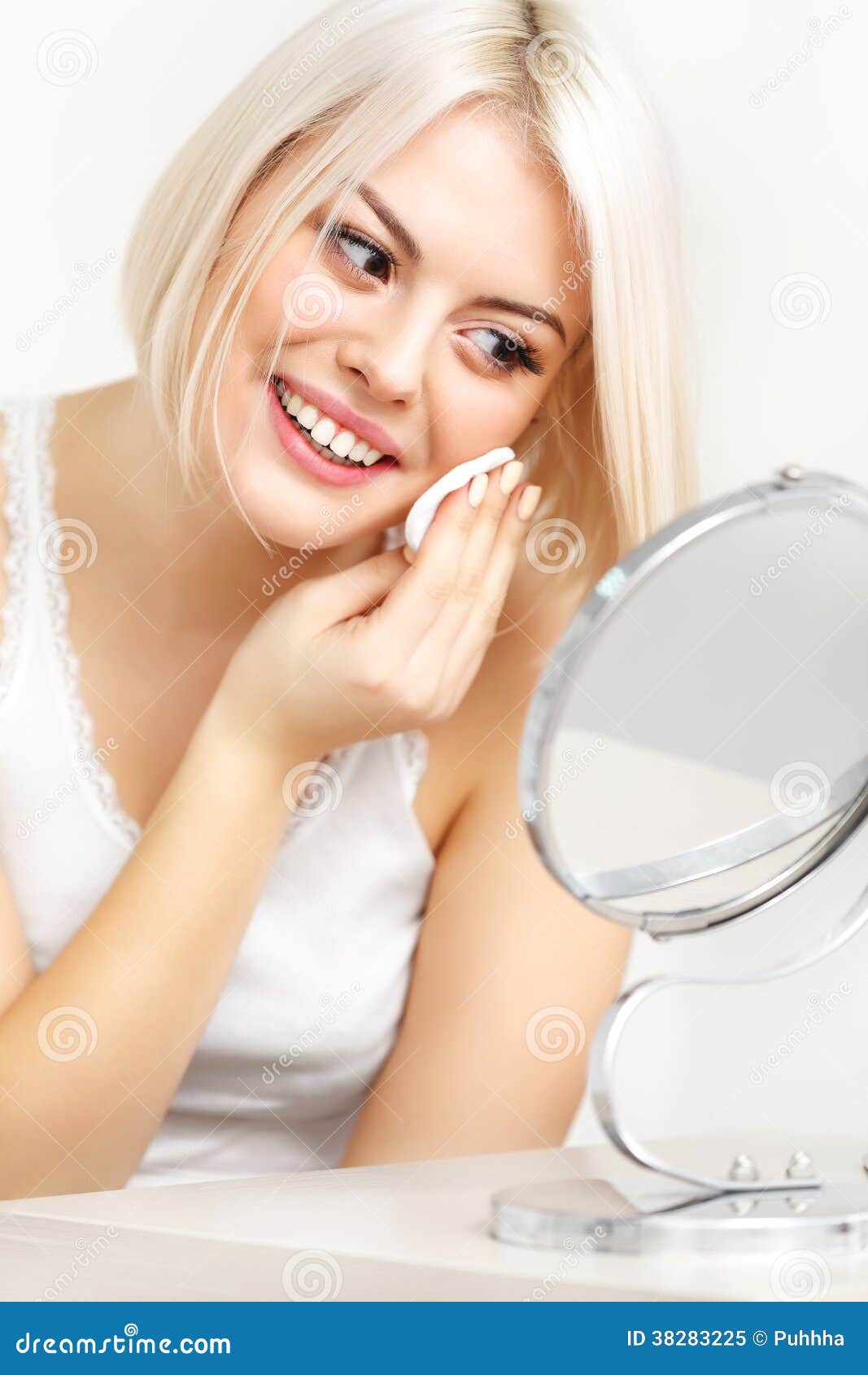 Makeup Applying. Beautiful Woman Looking at Her Face in the Miror Stock ...