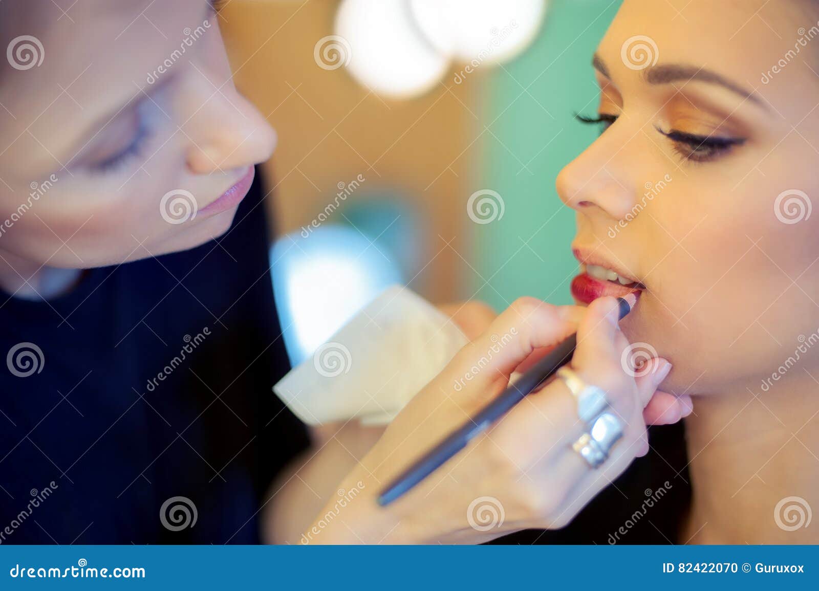 Makeup Artist Applying Lipstick Stock Photo - Image of face, attractive ...