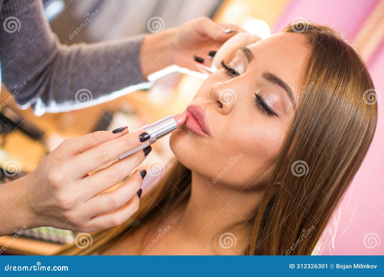 Makeup Artist Applying Pink Lipstick on Young Womans Lips Stock Image ...