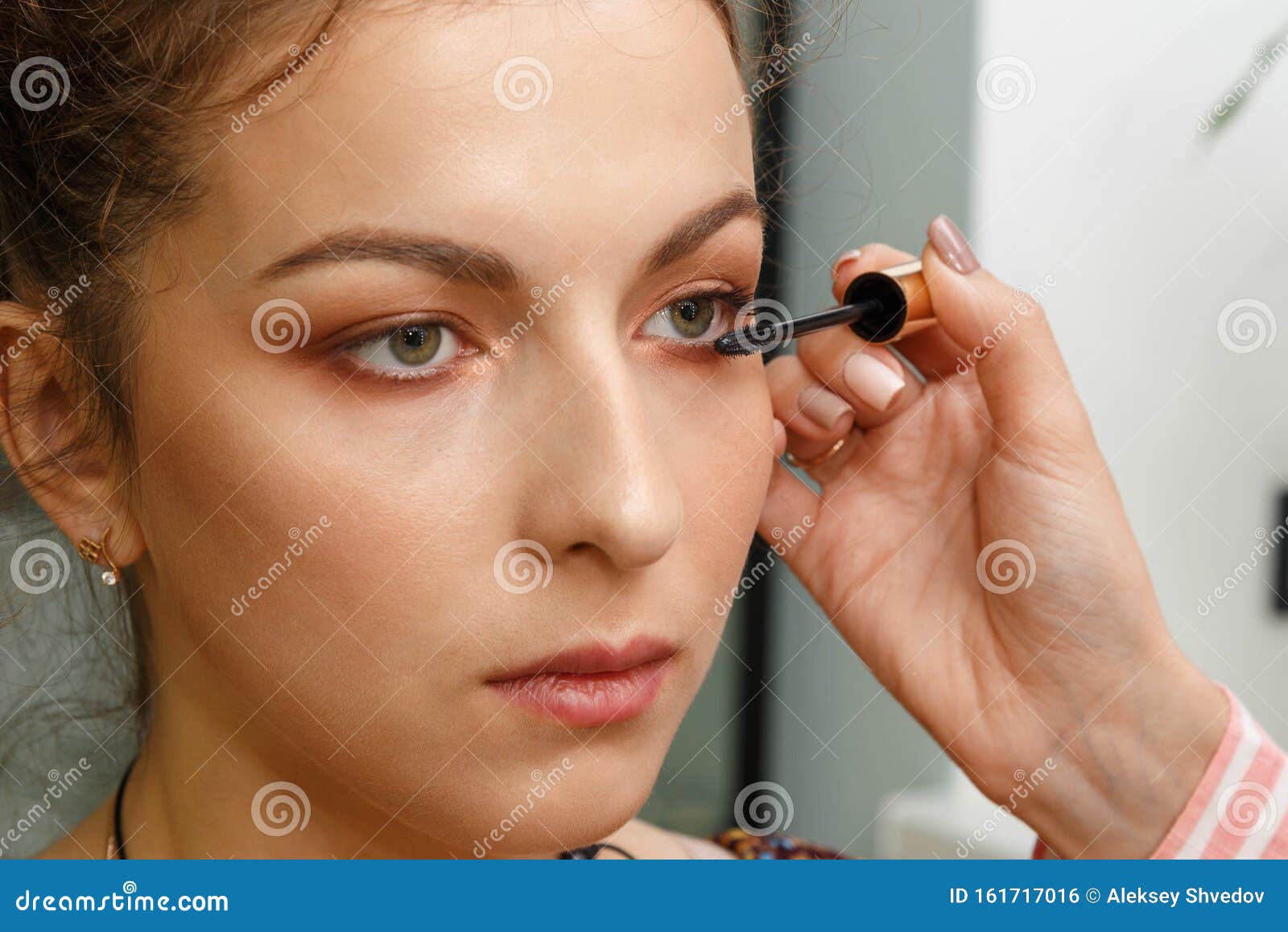 Makeup Artist Creates Voluminous Eyelashes of the Model Stock Photo ...