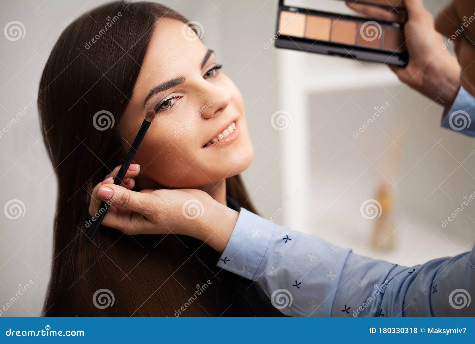 Makeup Artist Makes Professional Makeup To the Client at Her Home Stock ...