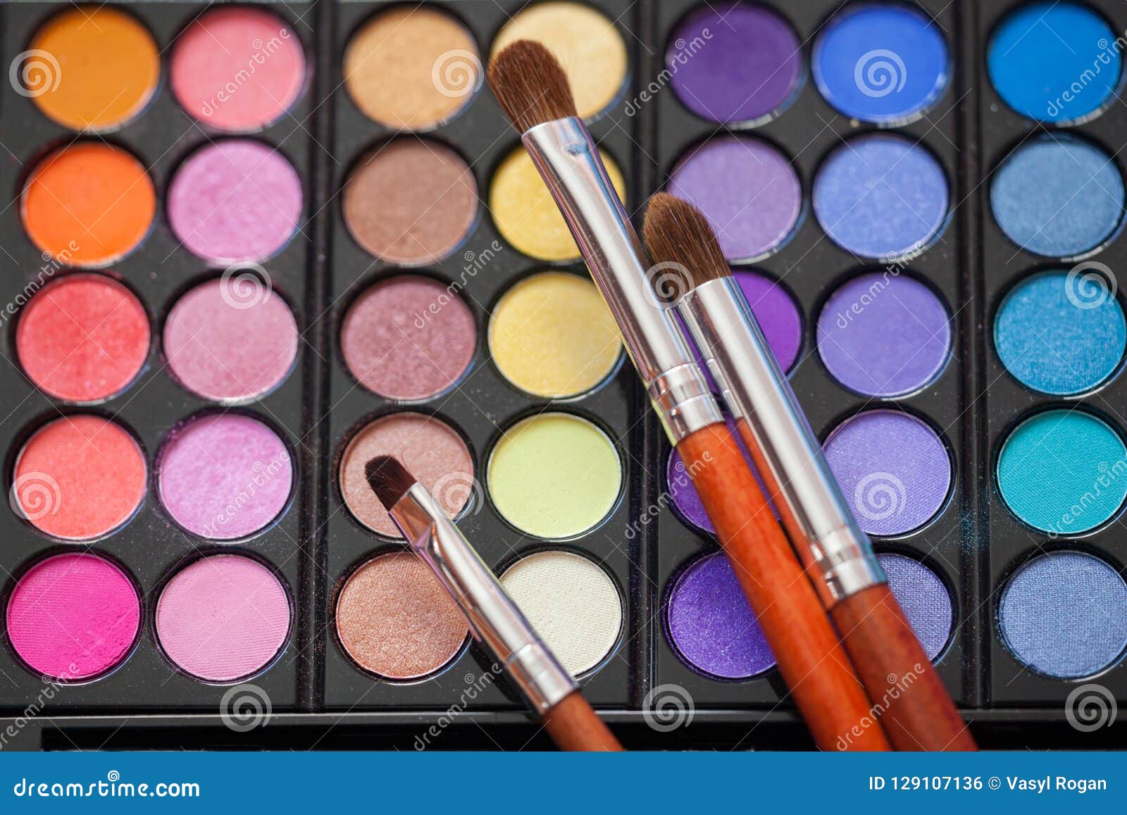 Makeup Brushes on Background with Colorful Powder. Macro Shooting ...