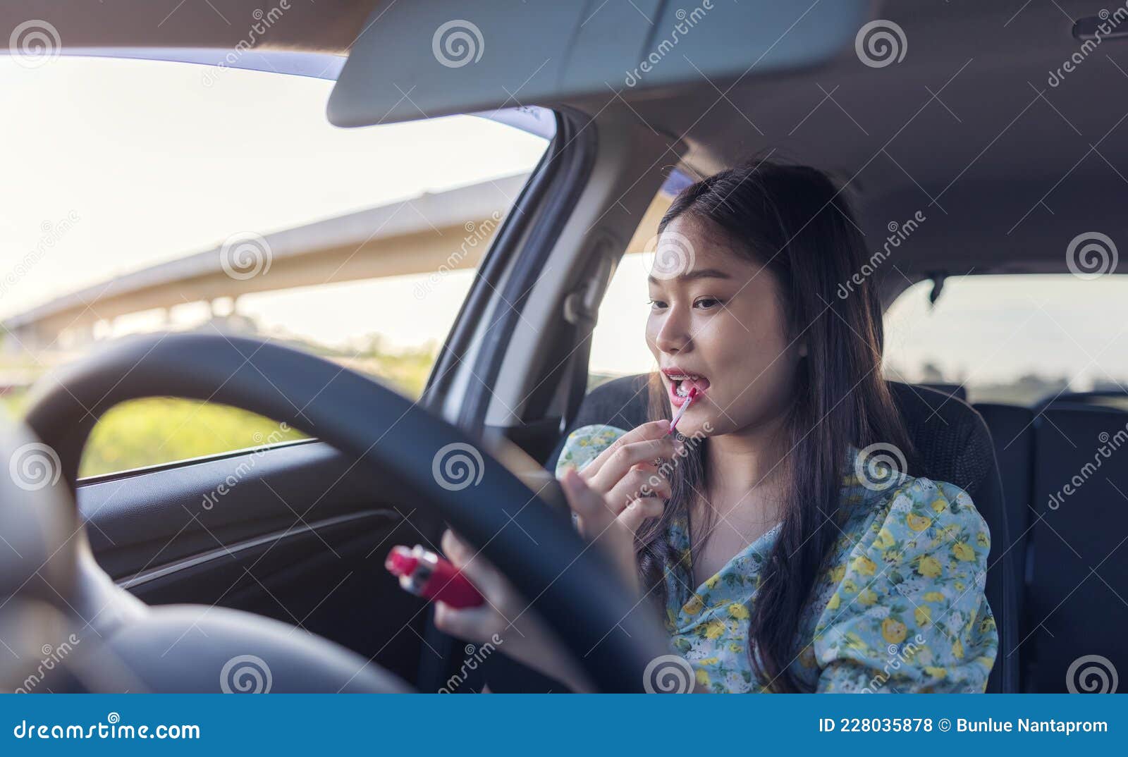 Makeup in the Car, Young Woman Applying Makeup while Driving Stock ...