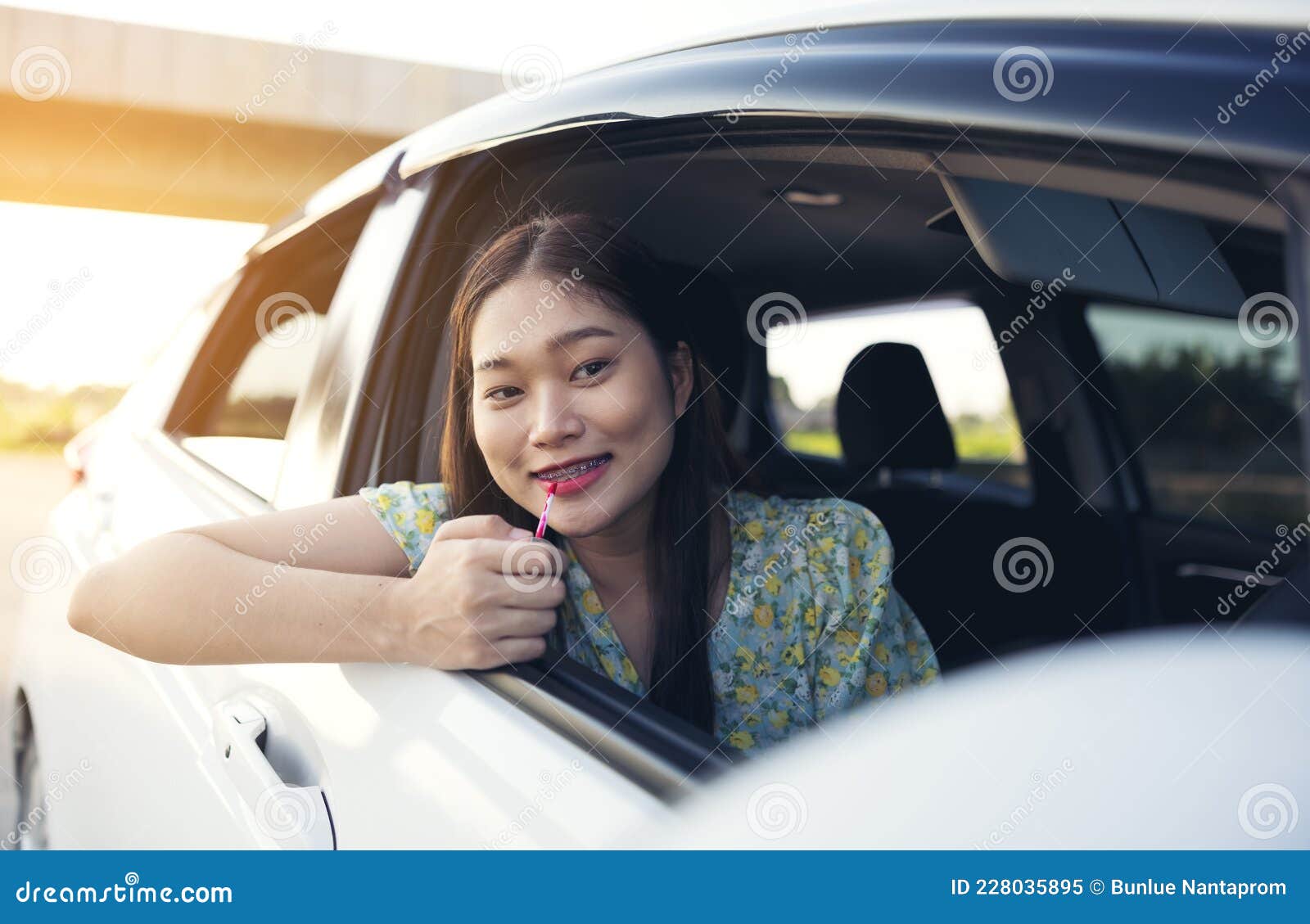 Makeup in the Car, Young Woman Applying Makeup while Driving Stock ...