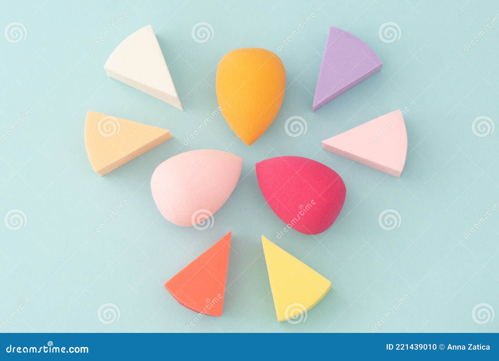 Makeup Sponges Triangular and Round Shapes on a Blue Background Stock ...