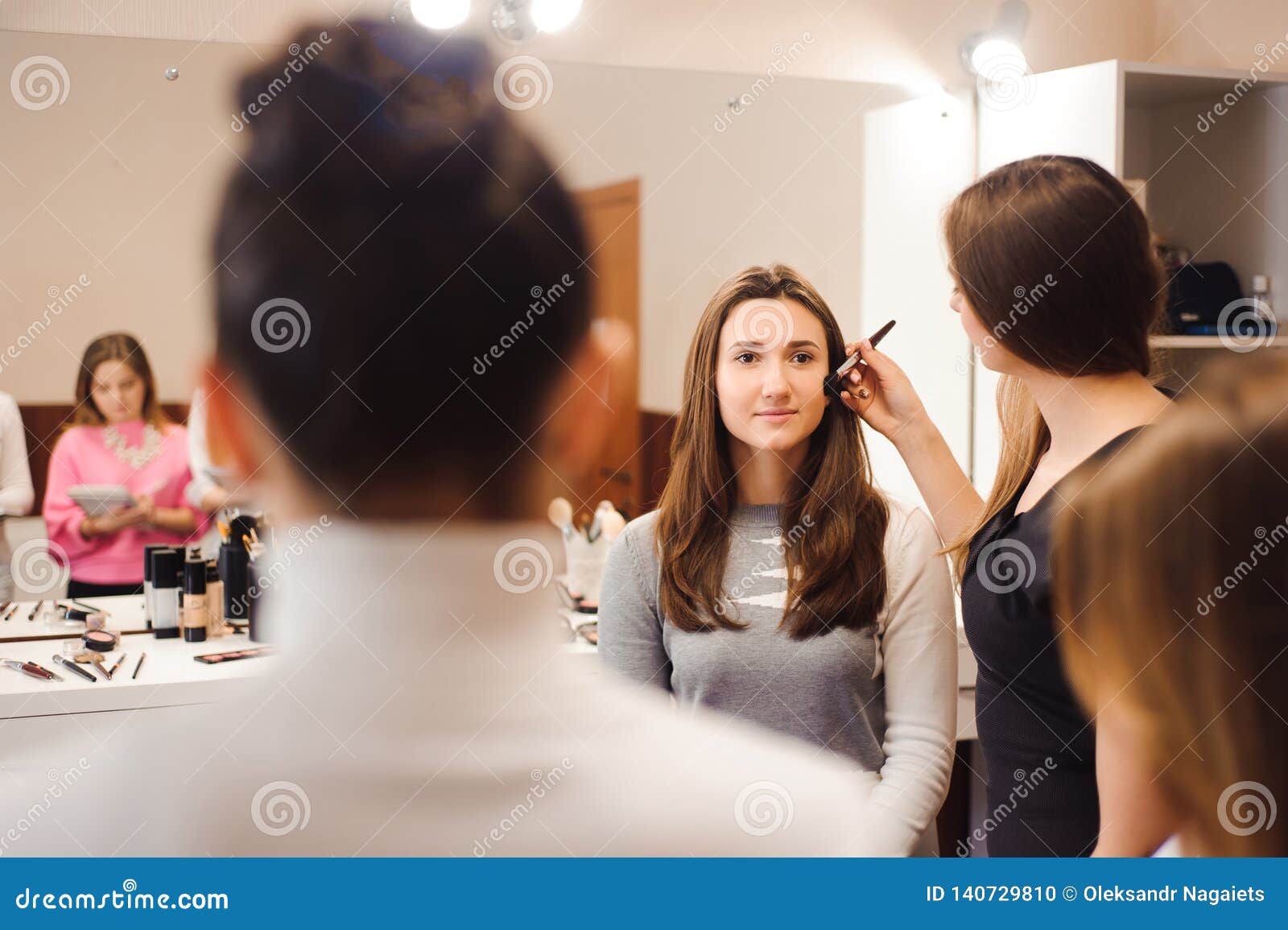 Makeup Teacher with Her Student Girls. Makeup Tutorial Lesson at Beauty ...