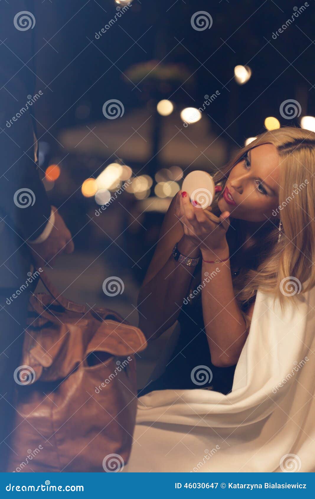 Makeup touch ups on a date stock image. Image of perfect - 46030647