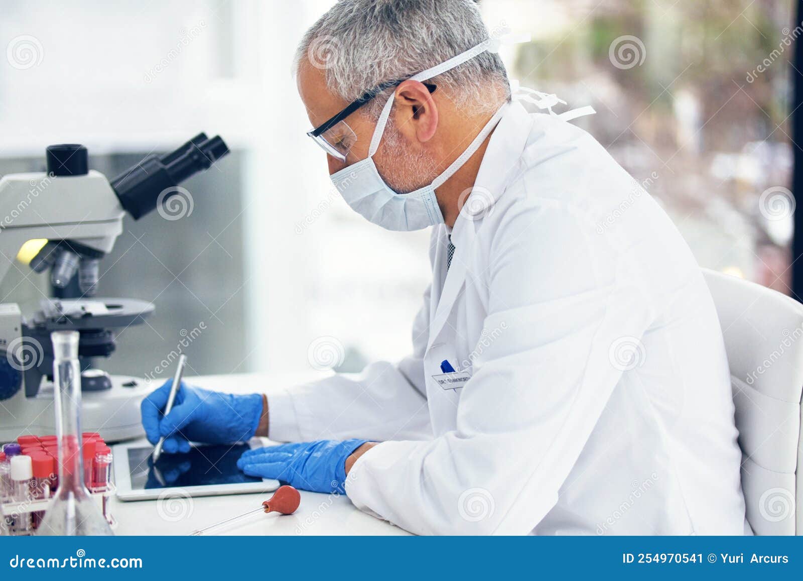 Making Another Breakthrough. a Scientist Recording His Findings on a ...