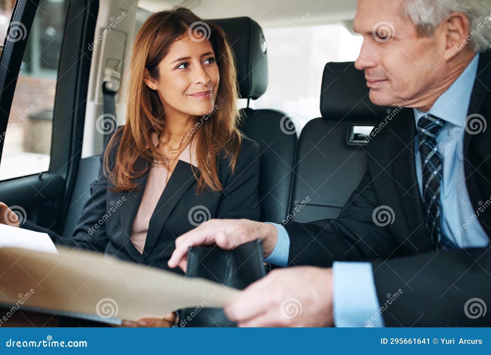 Making Business Connections in Commute. Colleagues Going through ...