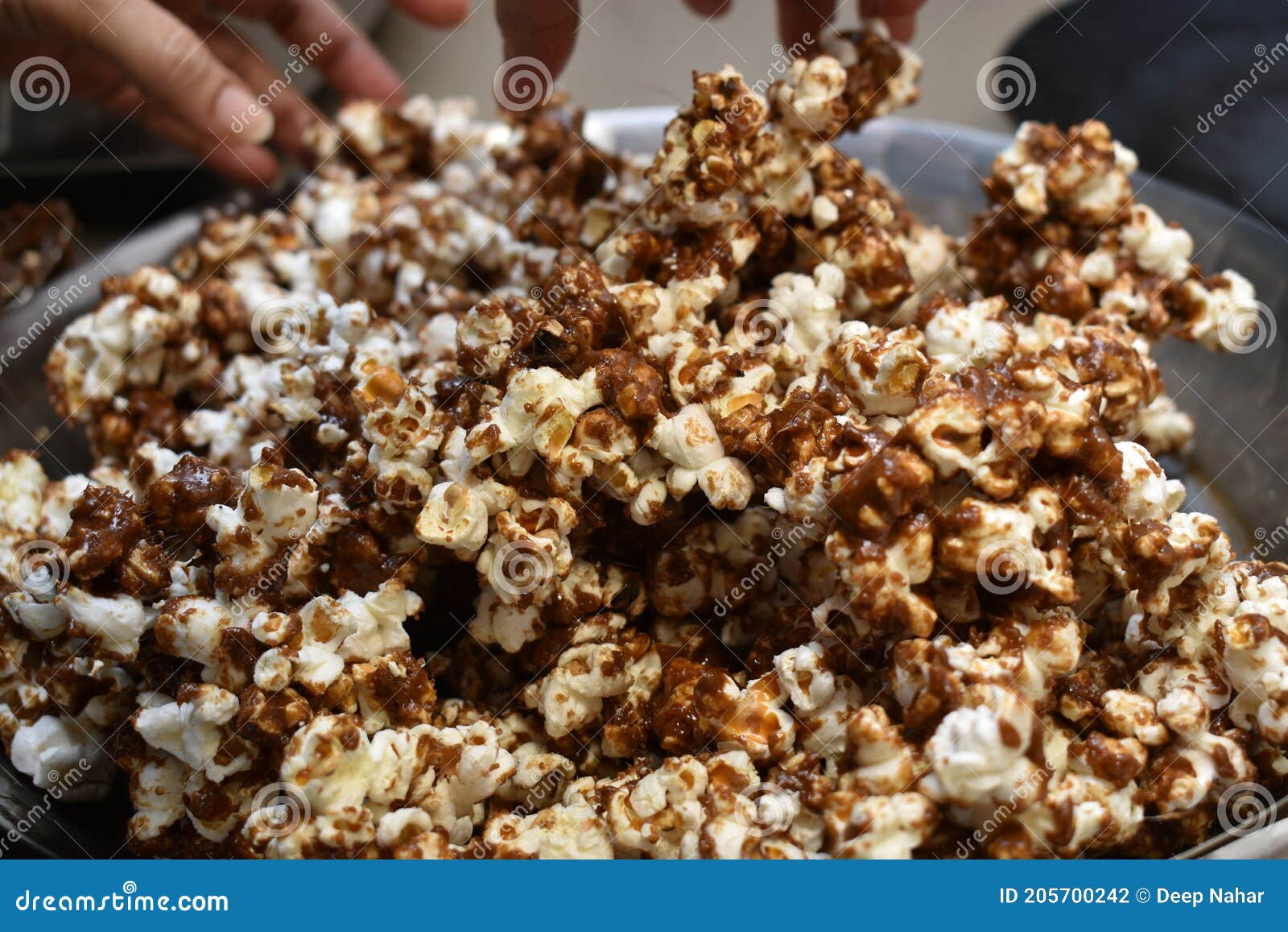 Making Caramel Popcorn with Hands in Vessel at Home Stock Photo - Image ...