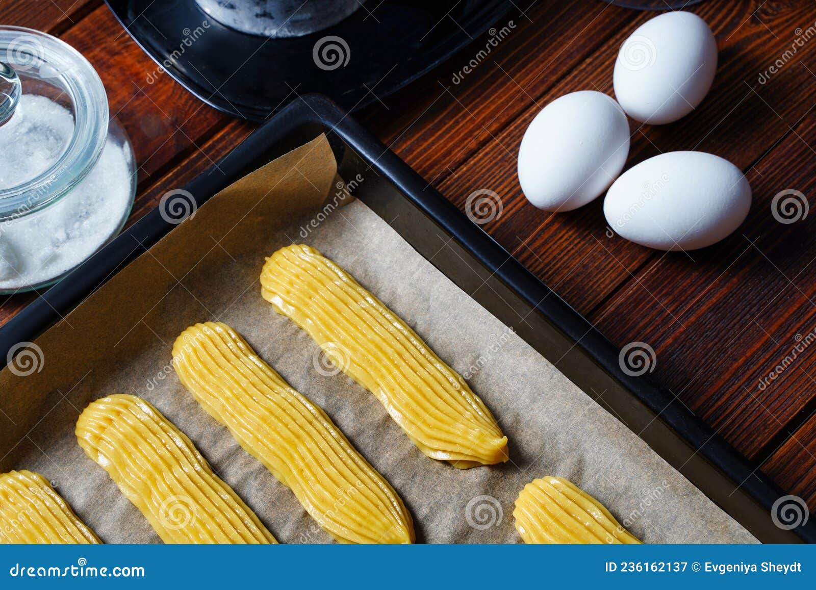 Making Eclairs. Homemade Eclair. Series. Transferred on a Baking Sheet ...