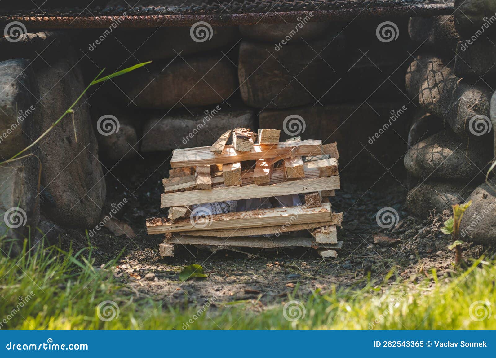 Making a Fire Using Paper and Small Wood Chips Stacked in Pyramid ...