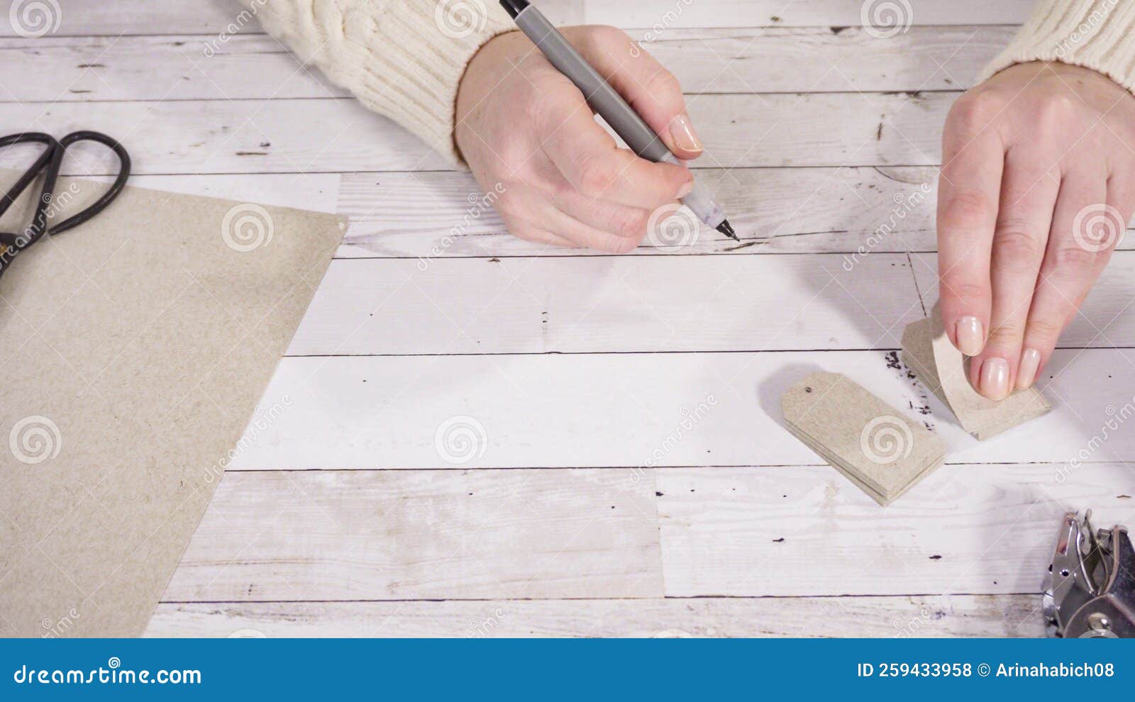 Making a gift tags stock photo. Image of handmade, gifts - 259433958