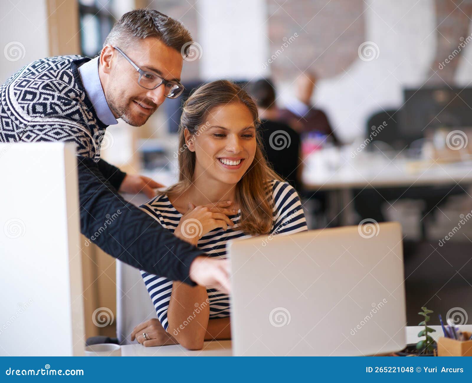 Making Great Progress on Their Project. Two Designers Working Together ...