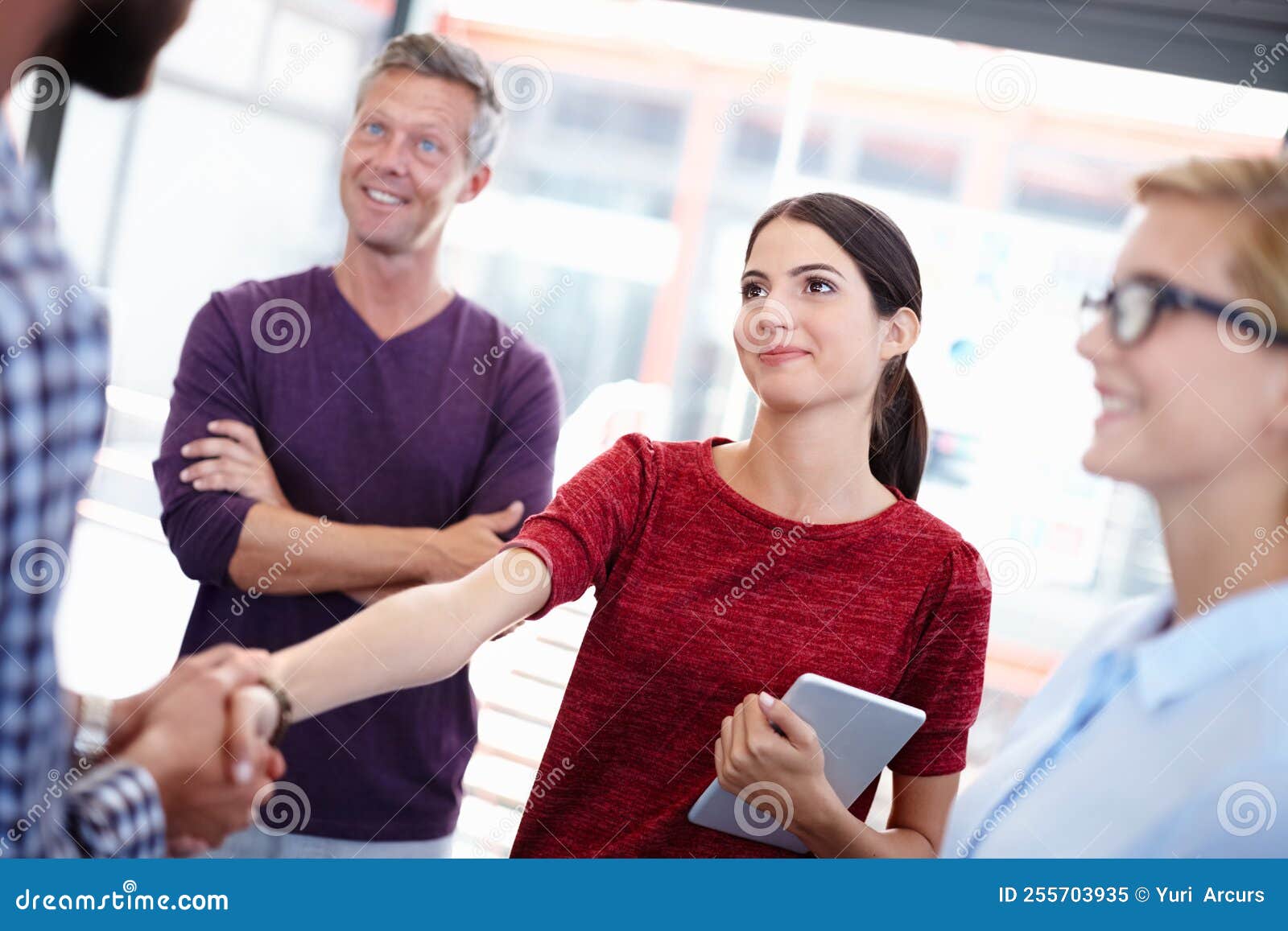 Making Her Feel Welcome. Two Coworkers Shaking Hands. Stock Image ...