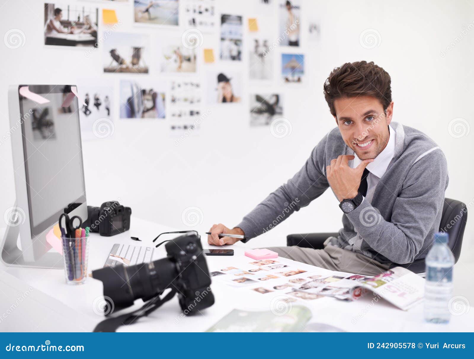 Making His Final Selection. a Photographer Looking at His Images in His ...