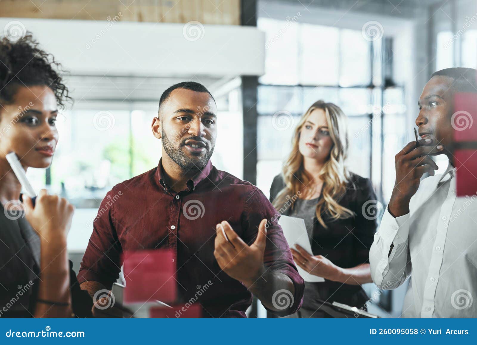 Making Idea Generation a Team Task. a Group of Young Businesspeople ...