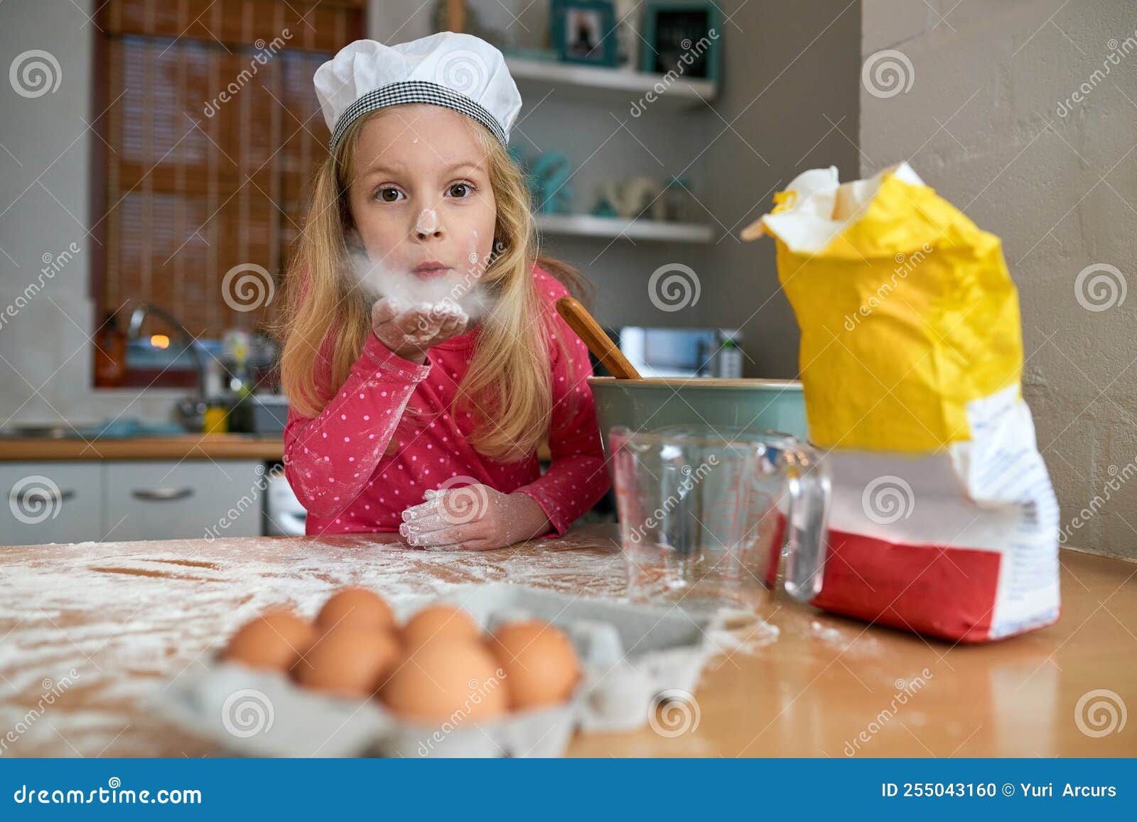 Making a Mess is Half the Fun. a Little Girl Baking in the Kitchen ...