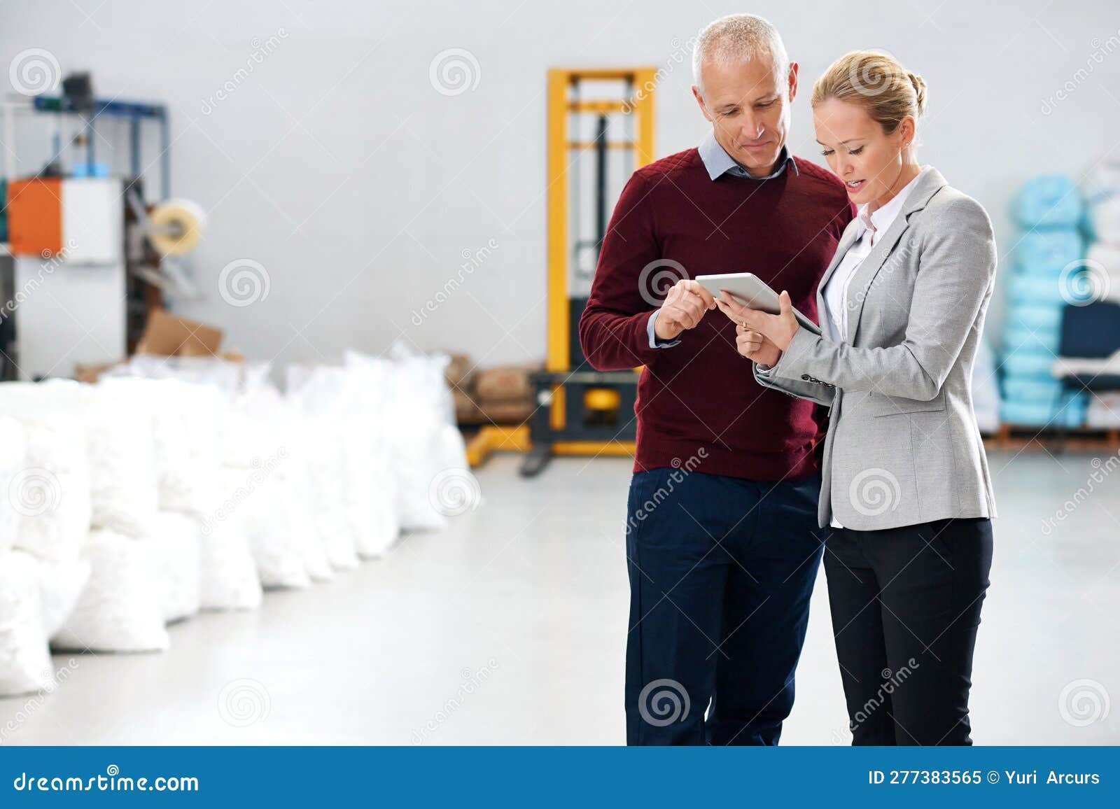 Making Notes during an Inspection. Managers Inside of a Warehouse ...