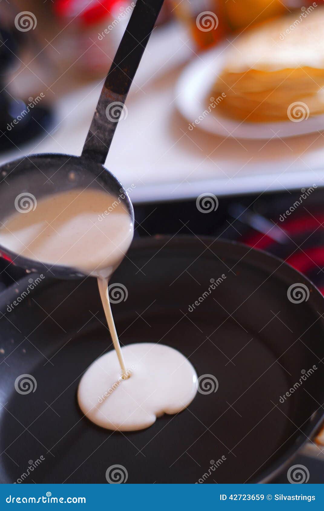 Batter pouring into pan stock image. Image of nutritious - 42723659