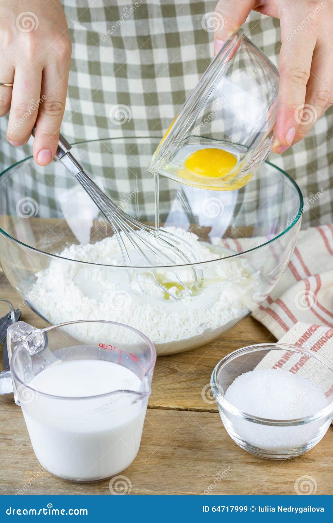 Making Pastry Dough. a Baker Adds an Egg into the Flour Stock Image ...